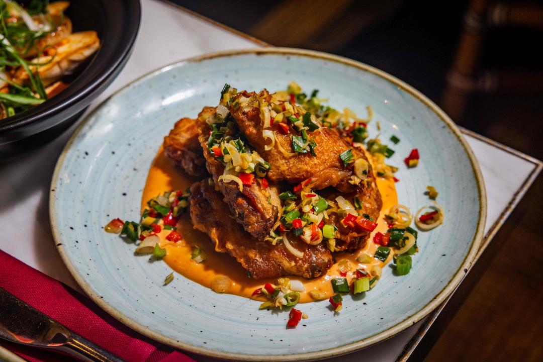 Receive Nam Vang-Style Chicken Wings to share when you book lunch for ...